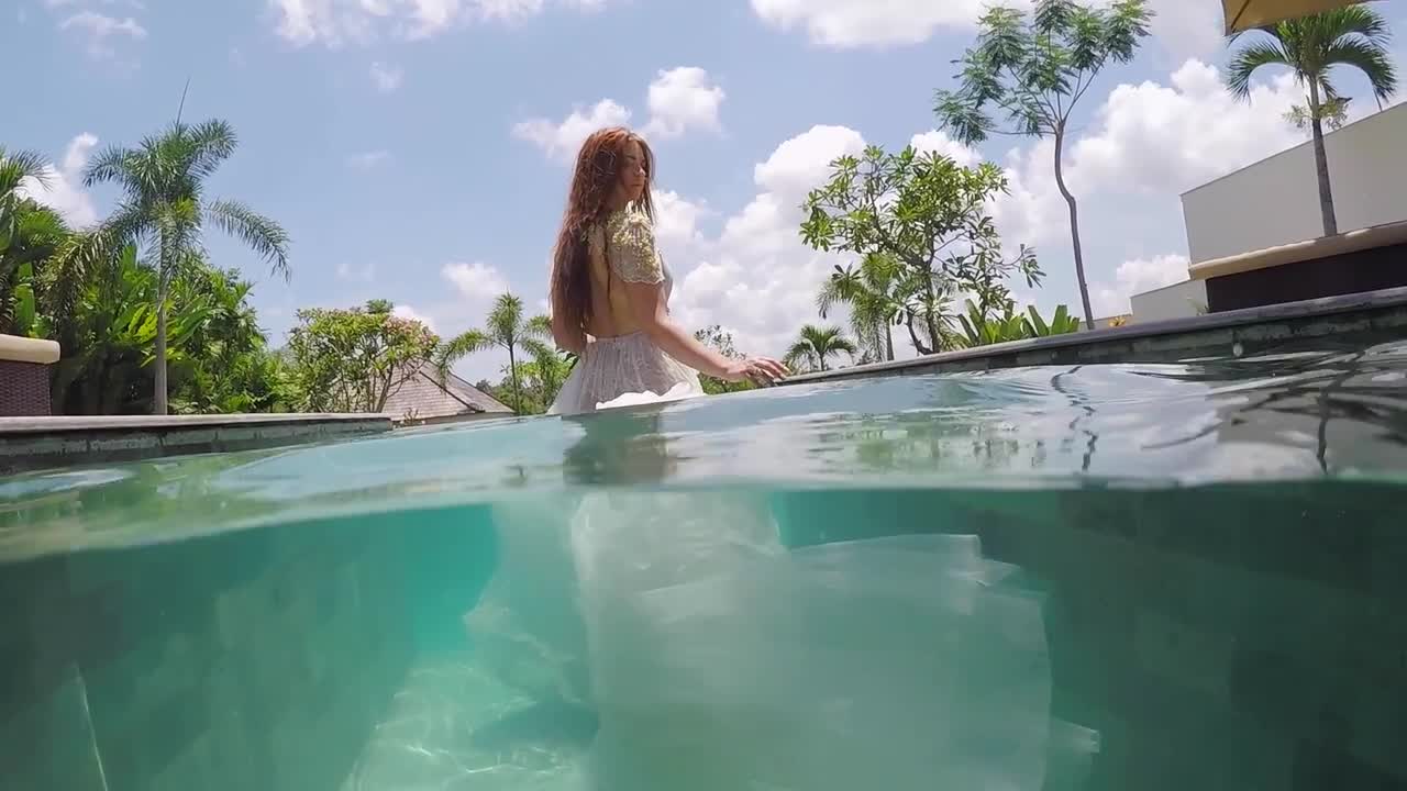A Bride In The Pool - Stock Video | Motion Array