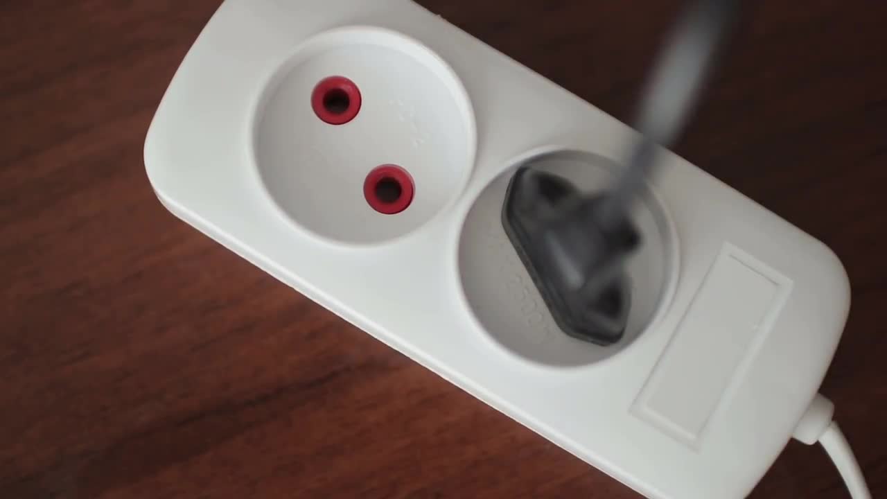 Hand Inserting A Plug - Stock Video | Motion Array