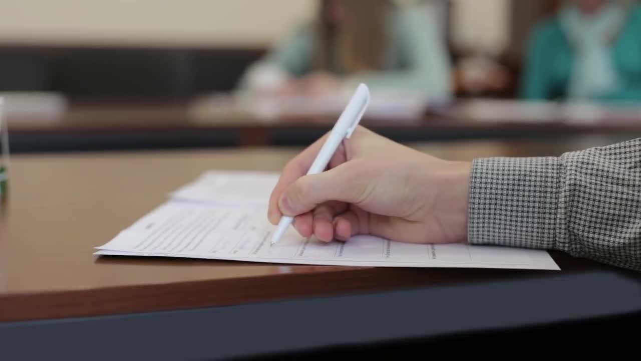 Man Filling Out Documents - Stock Video | Motion Array