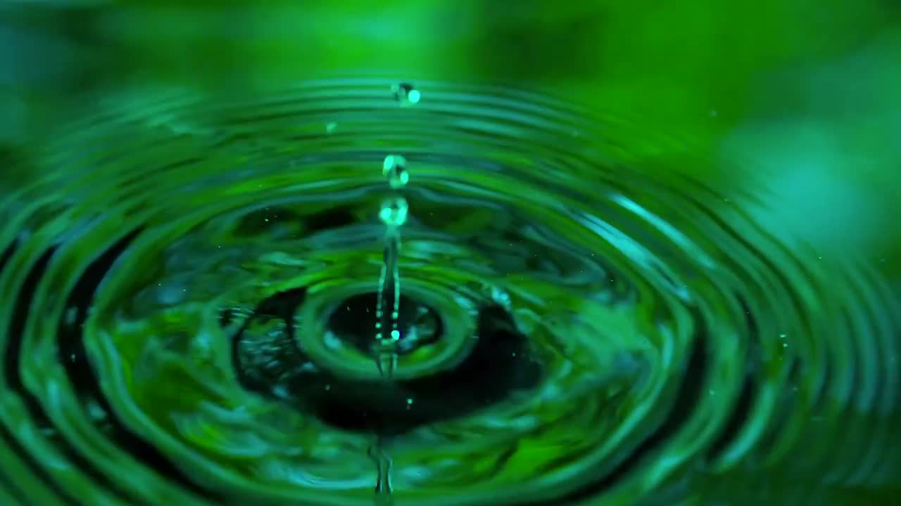 Water Drops In Green Lake - Stock Video | Motion Array