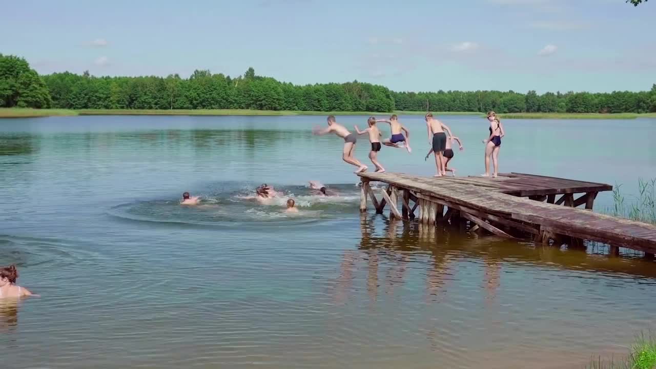 Children Swimming In Lake At Summer Vacation - Stock Video | Motion Array
