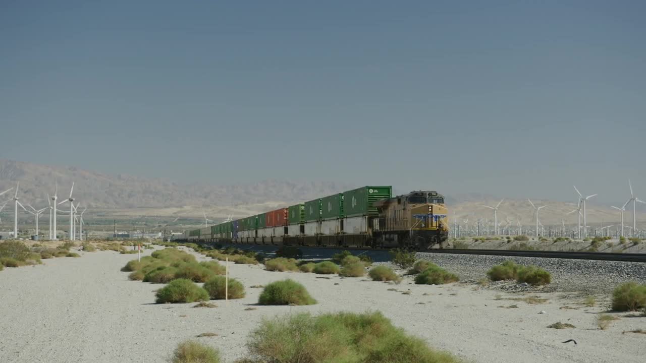 Train Passes Wind Turbines - Stock Video | Motion Array