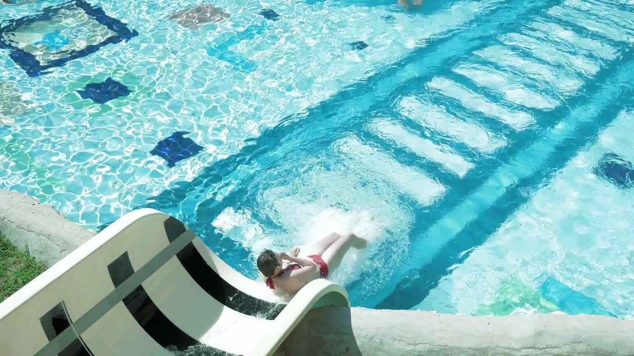 Sliding Into The Pool - Stock Video | Motion Array