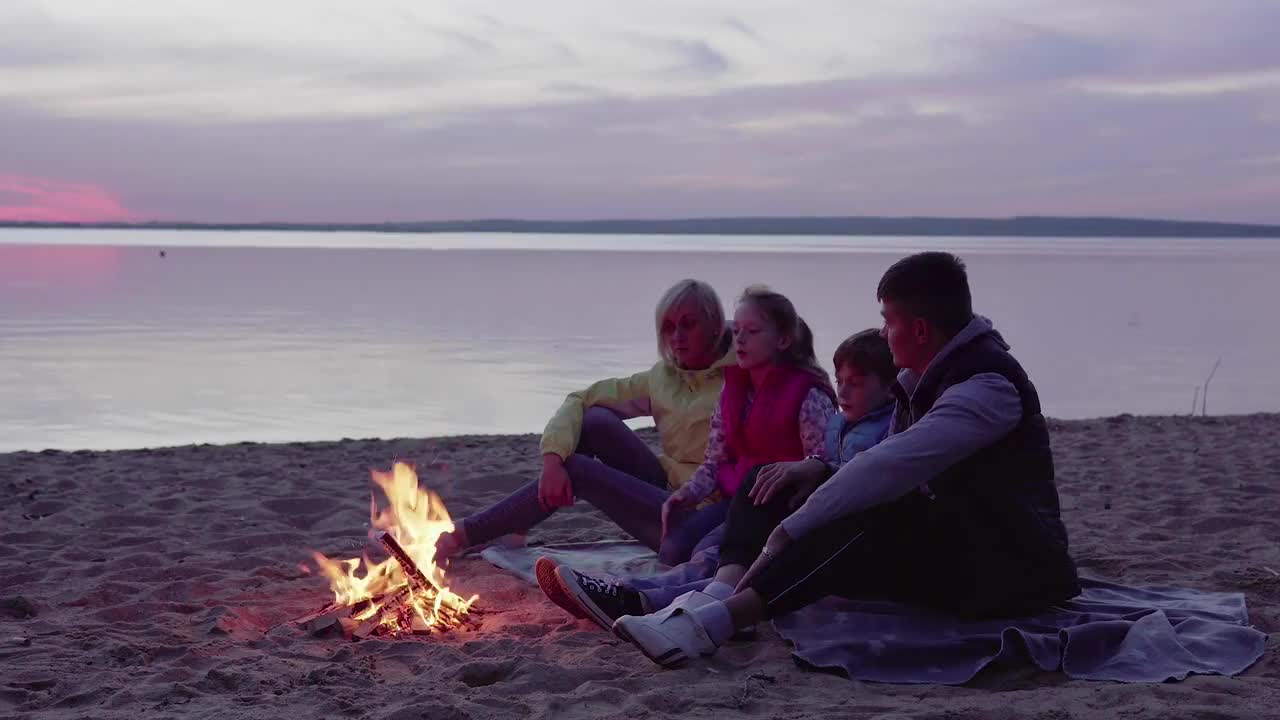 Family Talking By Campfire - Stock Video | Motion Array