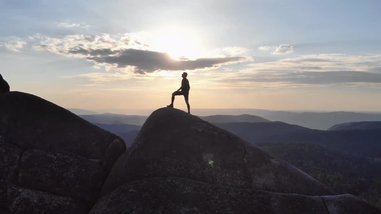 Man On Mountain Top - Stock Video | Motion Array