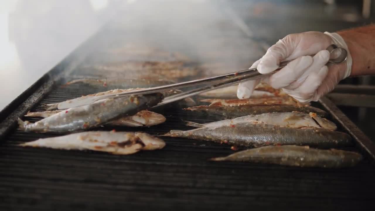 Flipping Grilled Fish - Stock Video | Motion Array