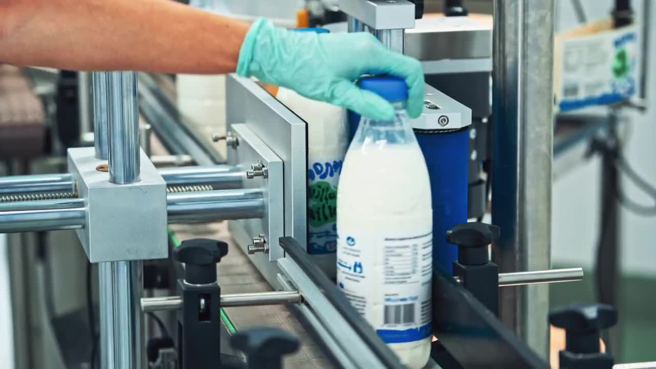 Milk Bottle Labelling - Stock Video | Motion Array