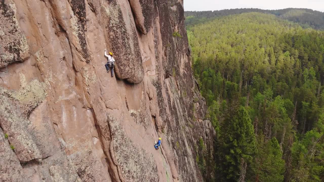 Climbers Scale Mountain - Stock Video | Motion Array