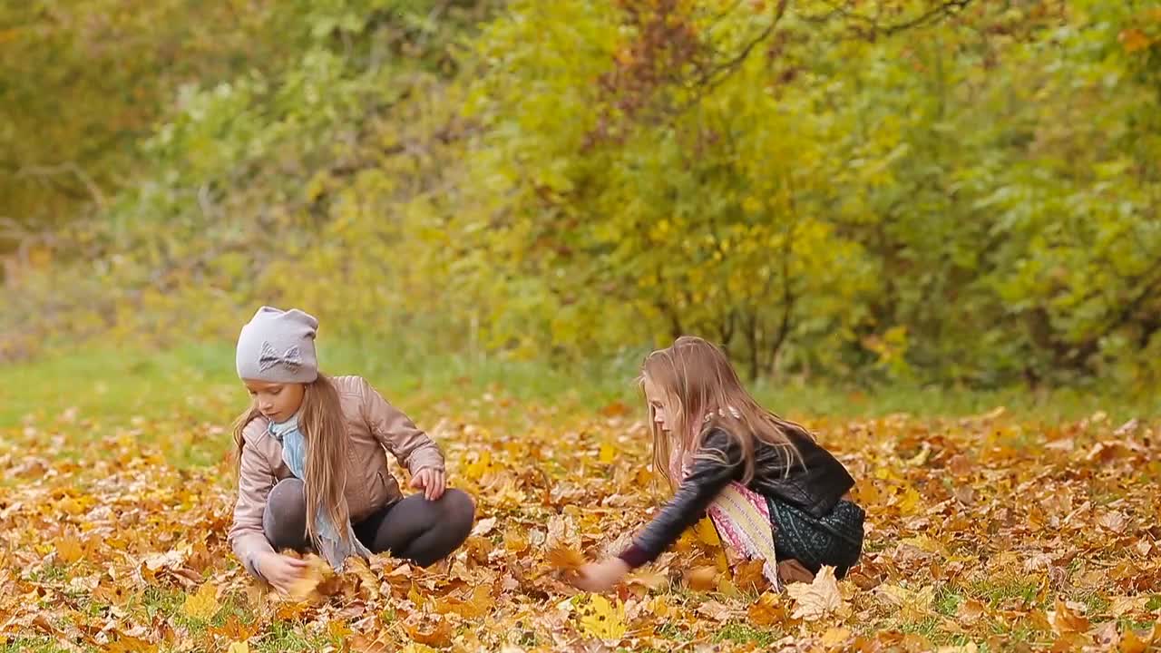 Kids Gathering Leaves - Stock Video | Motion Array