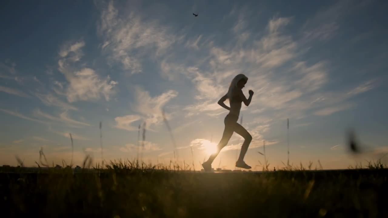 Runner At Sunset - Stock Video | Motion Array