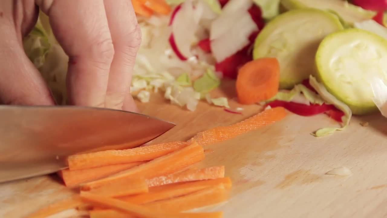 Cutting Carrot Strips - Stock Video | Motion Array