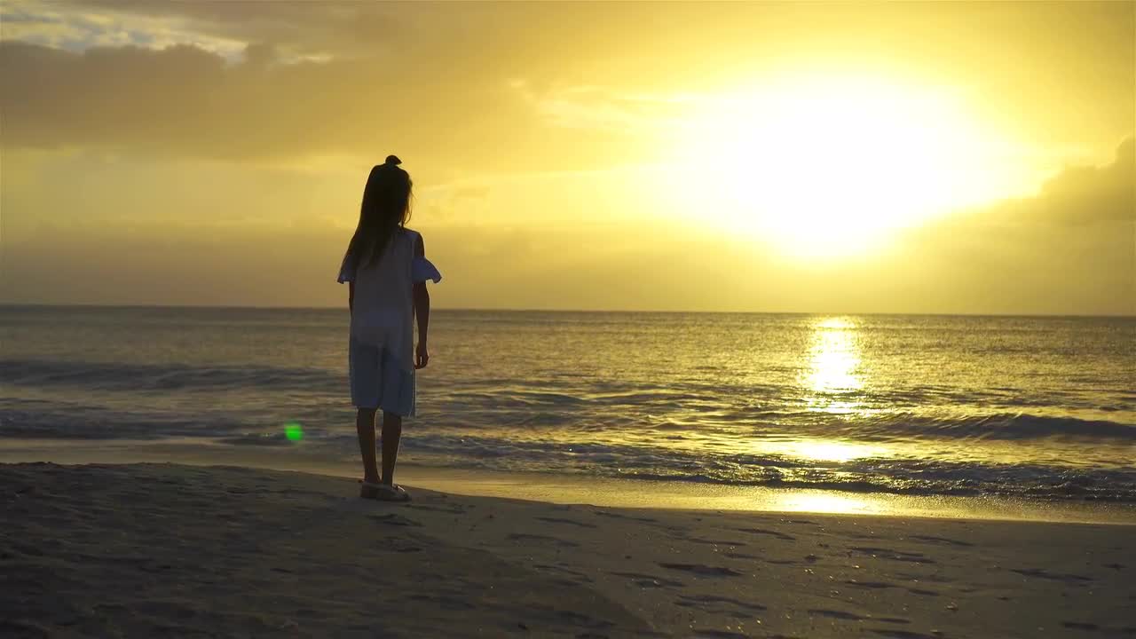 Girl Watches Sunset - Stock Video | Motion Array