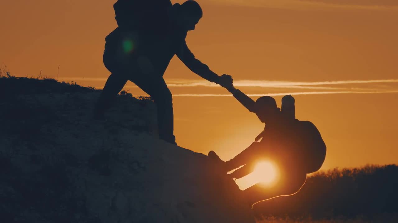 Helping Each Other Climb - Stock Video | Motion Array