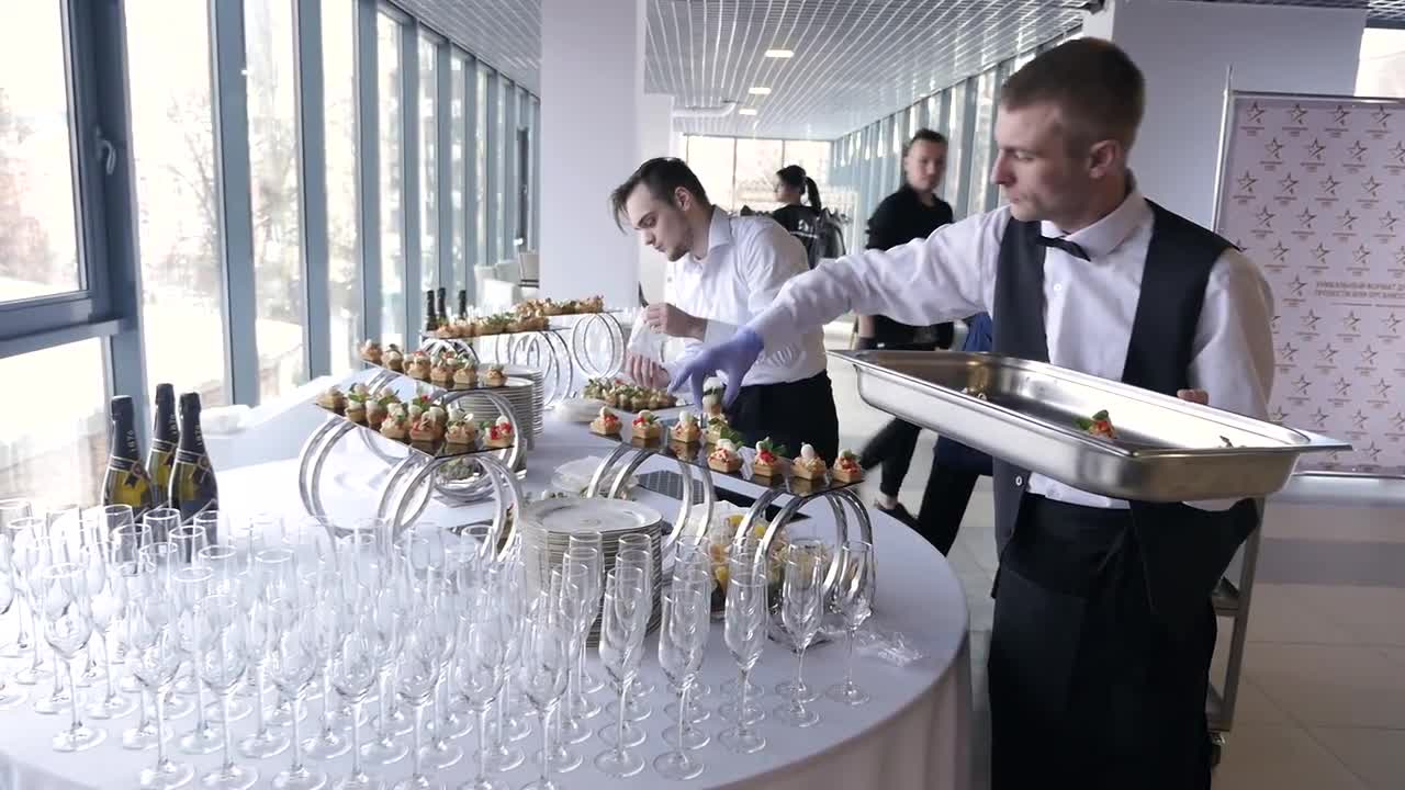 Waiters Set The Table - Stock Video | Motion Array