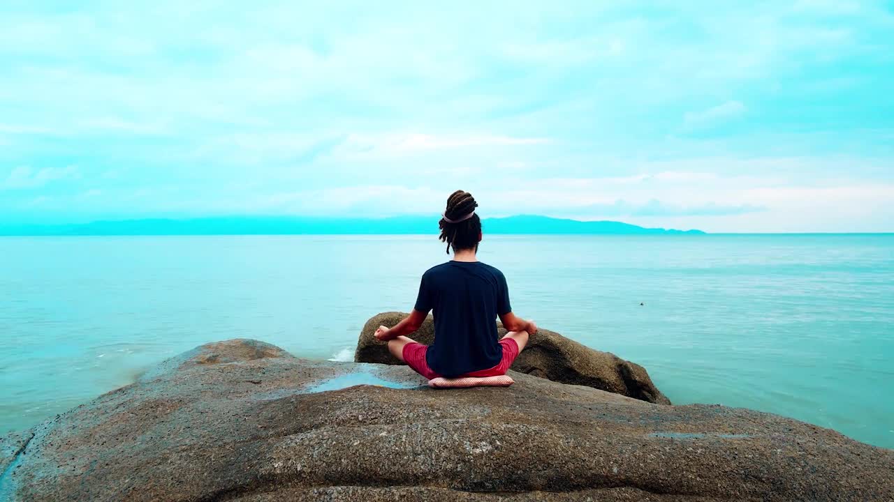 Meditation By The Sea - Stock Video | Motion Array