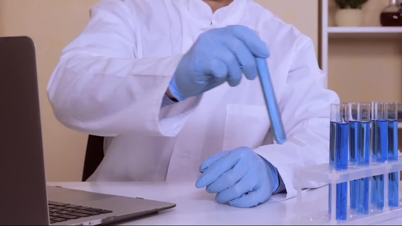 Scientist Shaking Test Tube - Stock Video | Motion Array