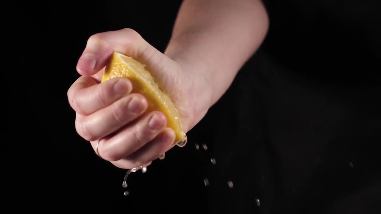 Squeezing Lemon - Stock Video | Motion Array