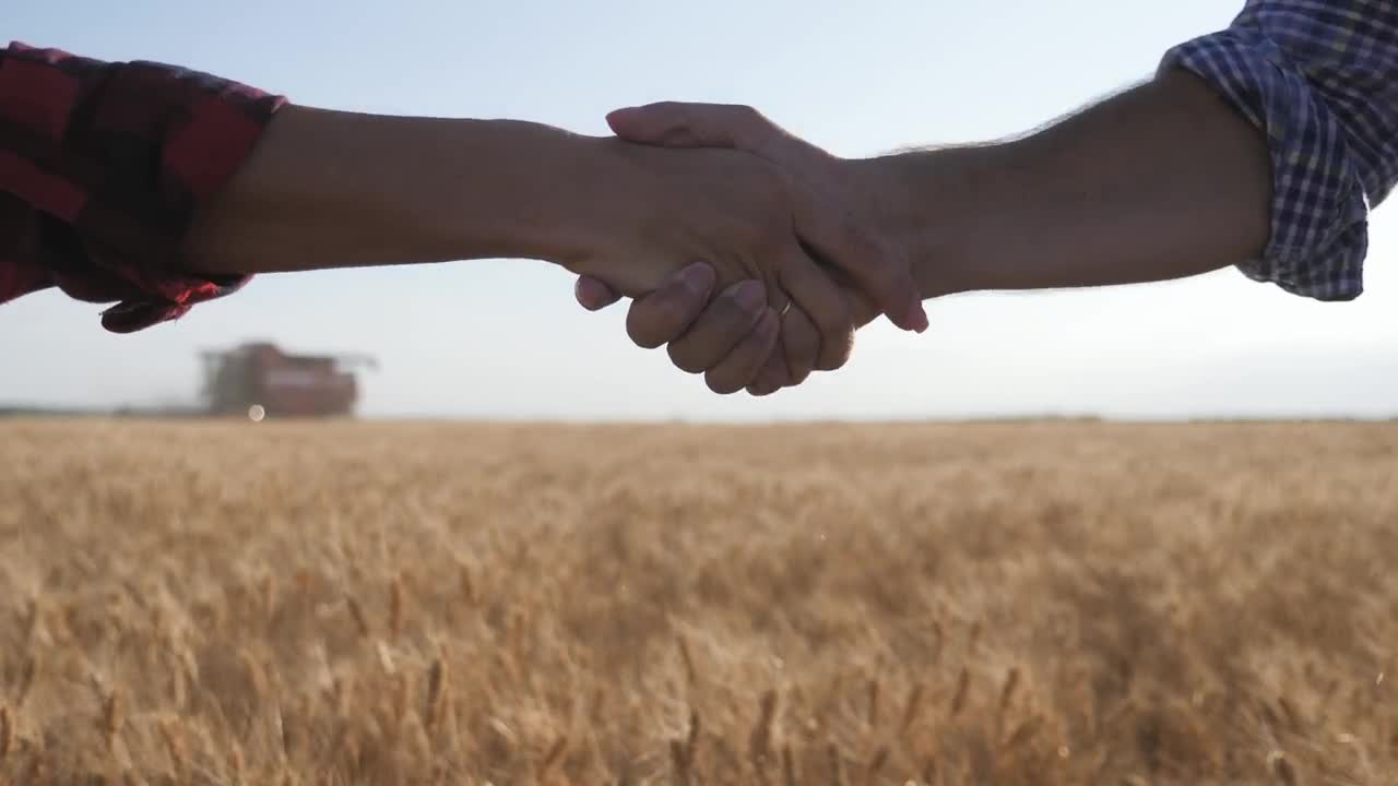 Farmer Shaking Hands By Field - Stock Video | Motion Array