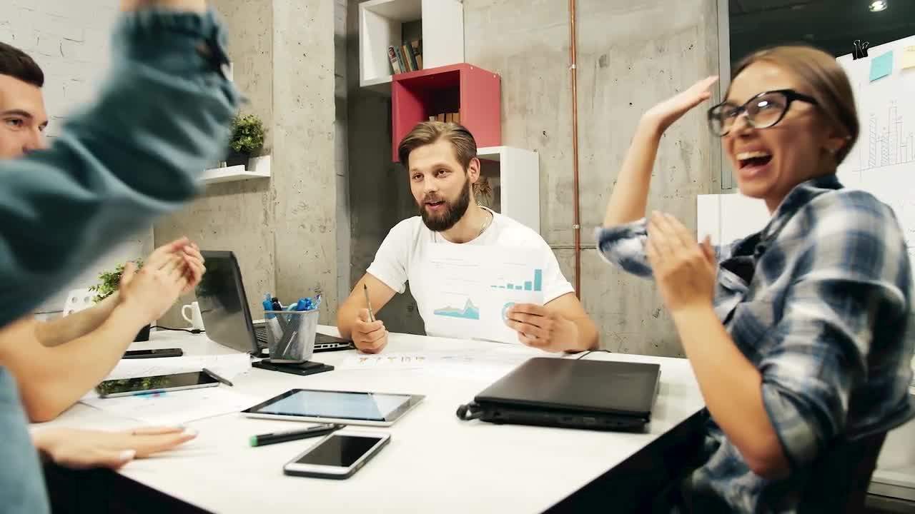 Coworkers Cheer During Meeting - Stock Video | Motion Array
