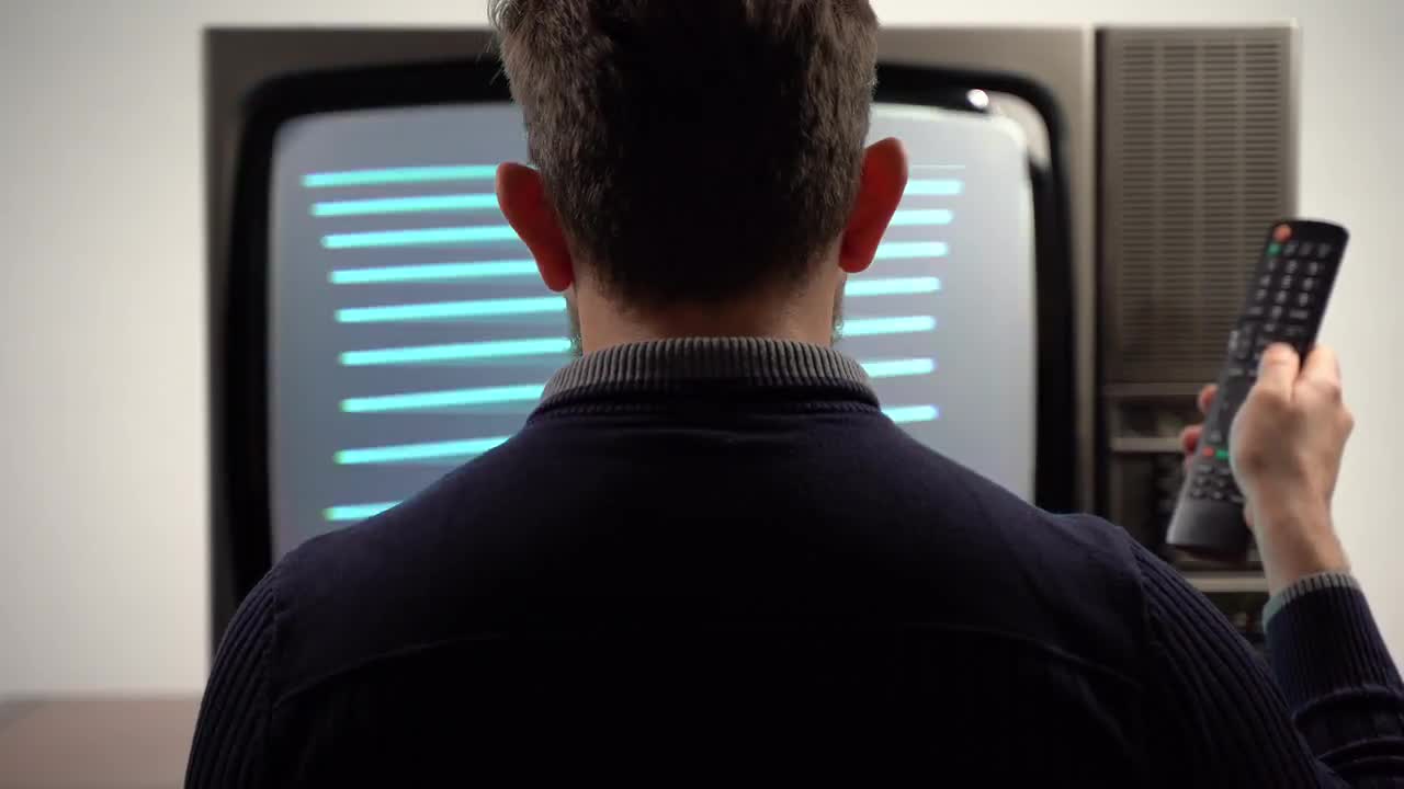 Man Changing TV Channels - Stock Video | Motion Array