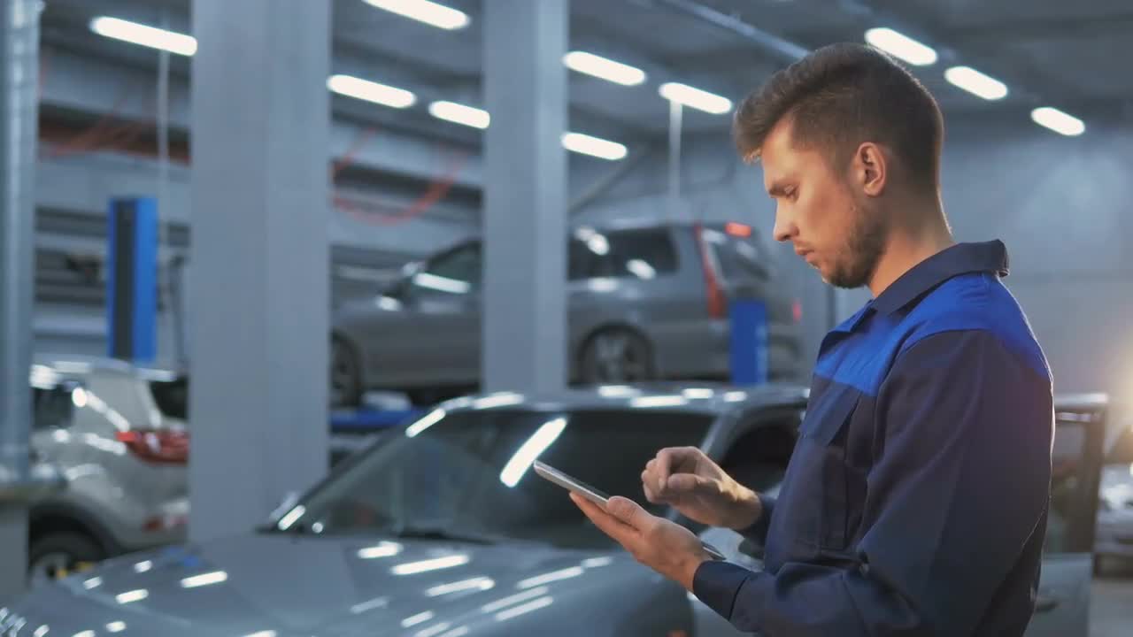 Mechanic With Tablet - Stock Video | Motion Array