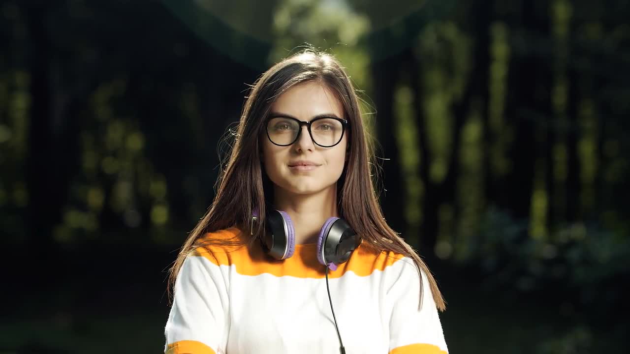 Brunette Breaking Into A Smile - Stock Video | Motion Array