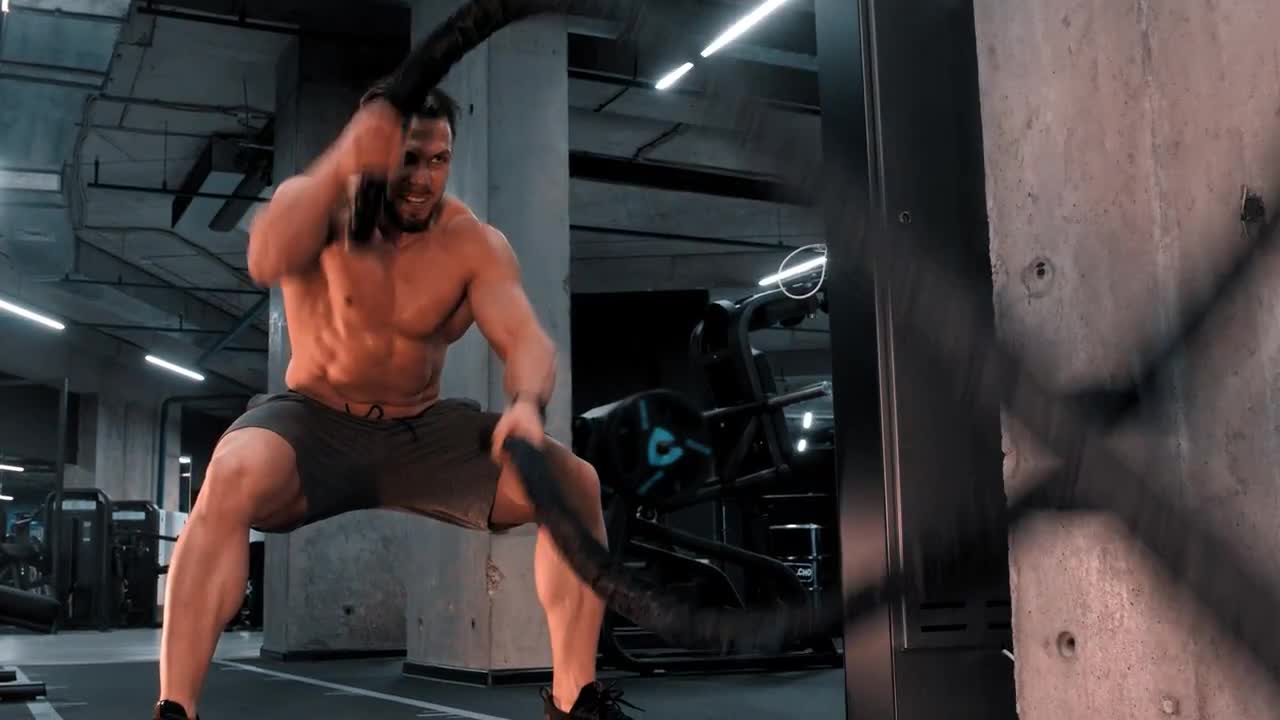 Man Swinging Ropes In Gym - Stock Video | Motion Array