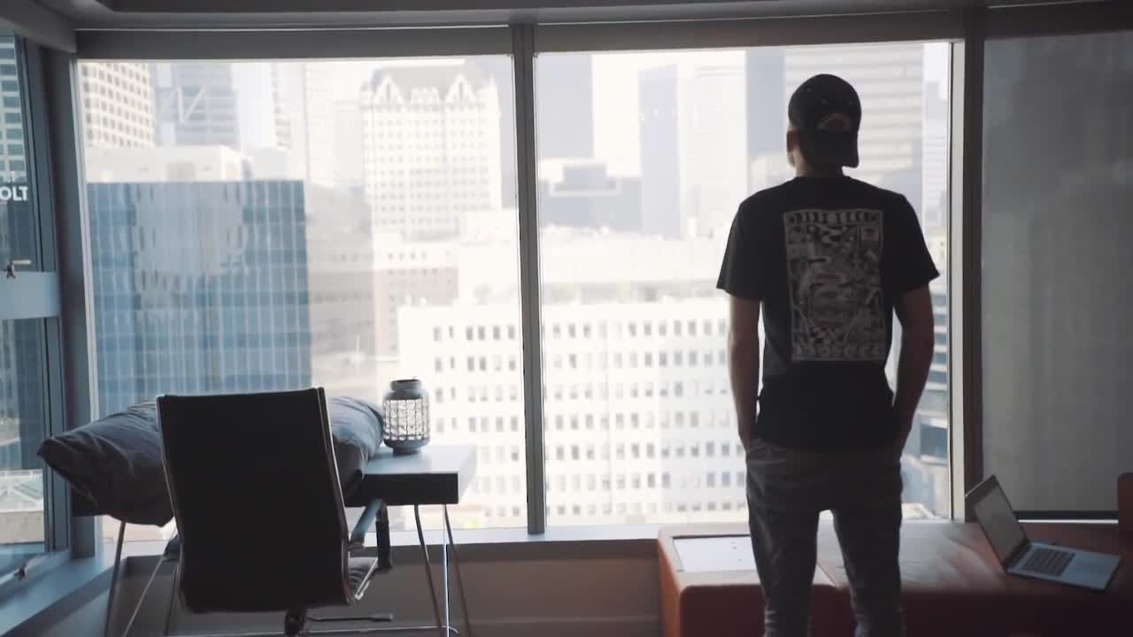 Man Staring Out Apartment Window - Stock Video | Motion Array