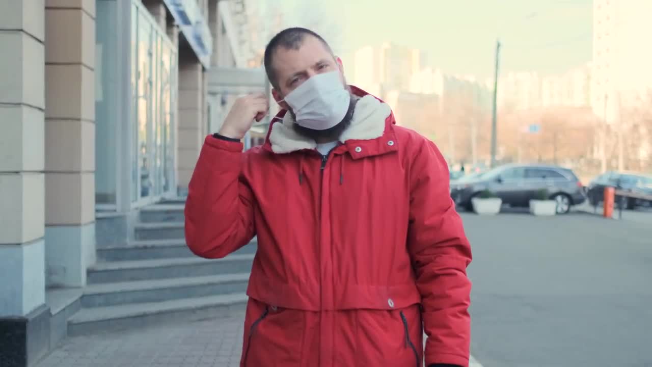 Man Takes Off Medical Mask - Stock Video | Motion Array
