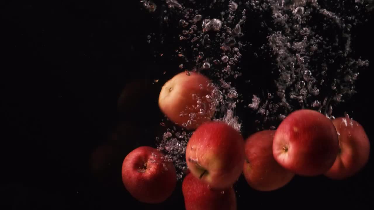 Apples Falling Into Water - Stock Video | Motion Array