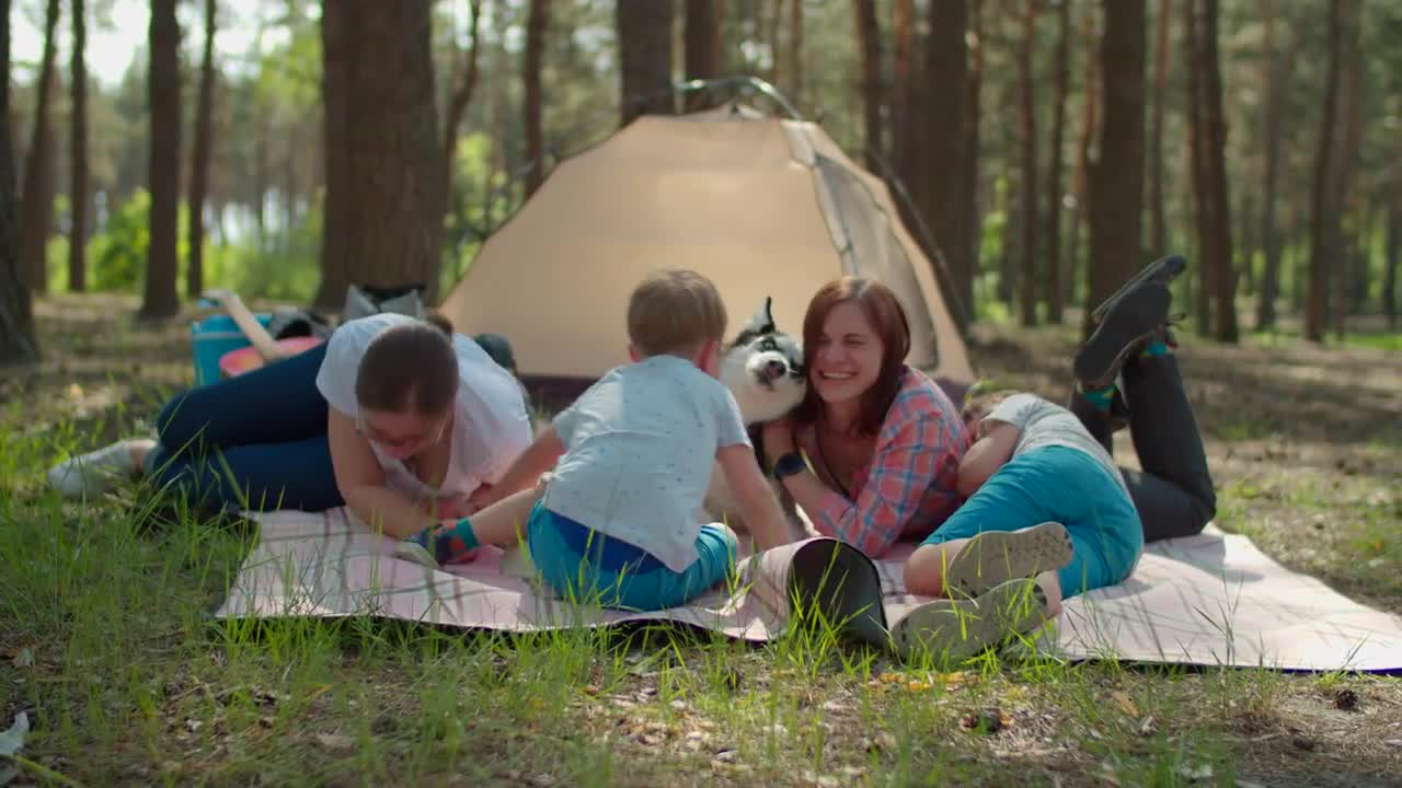 2 Moms & Kids Camping - Stock Video | Motion Array