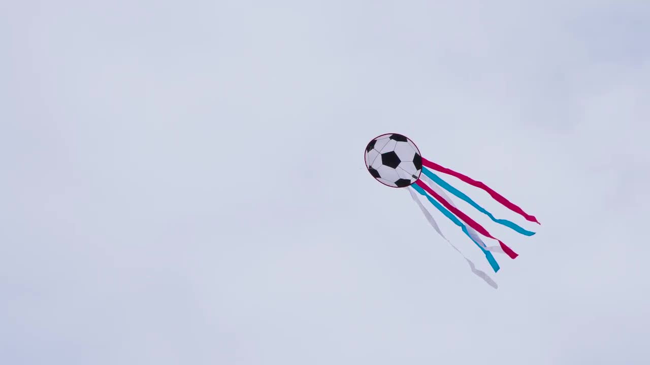 Soccer Ball Kite In Flight - Stock Video | Motion Array