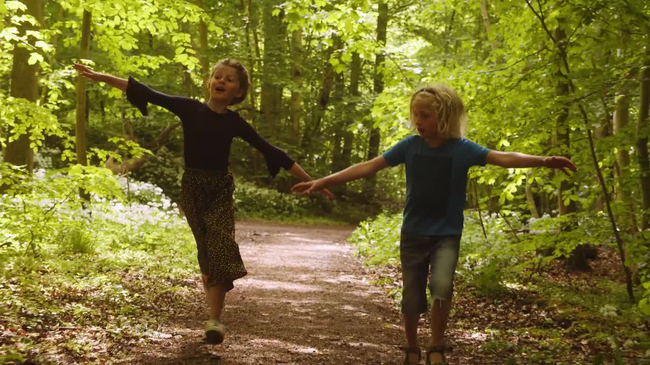 Happy Children Running In Forest - Stock Video | Motion Array
