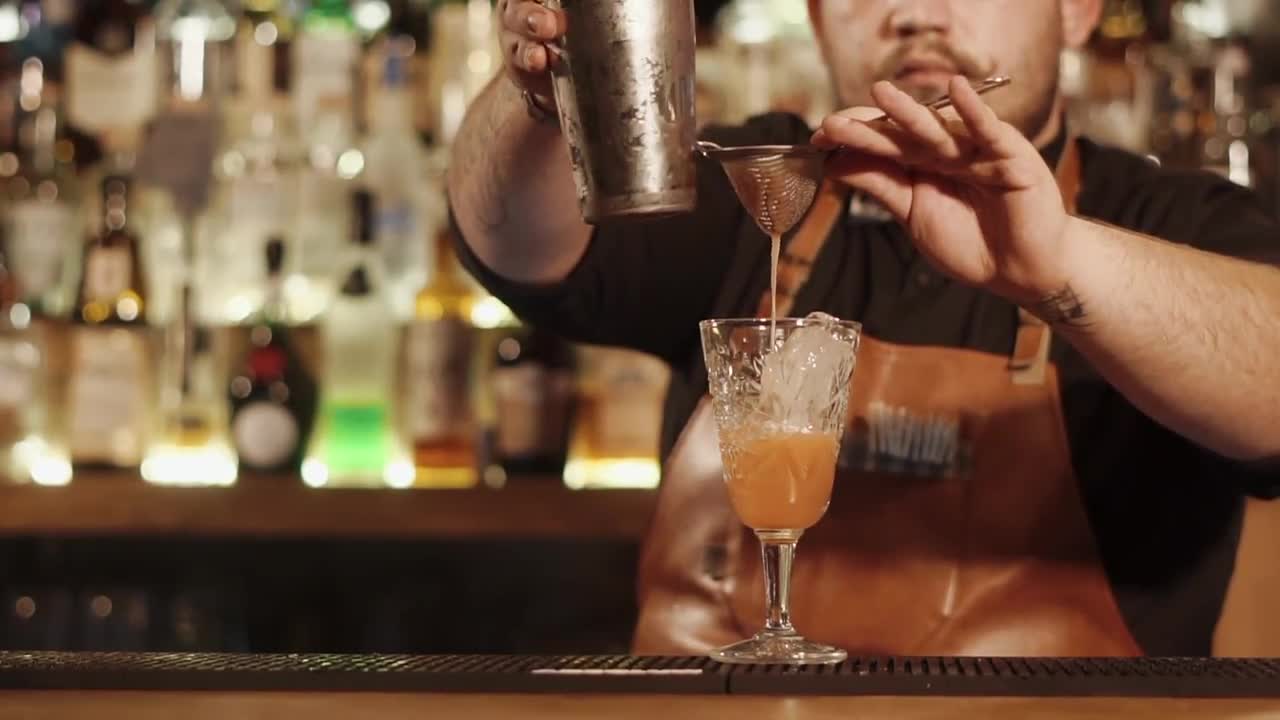 Bartender Straining Cocktail - Stock Video | Motion Array