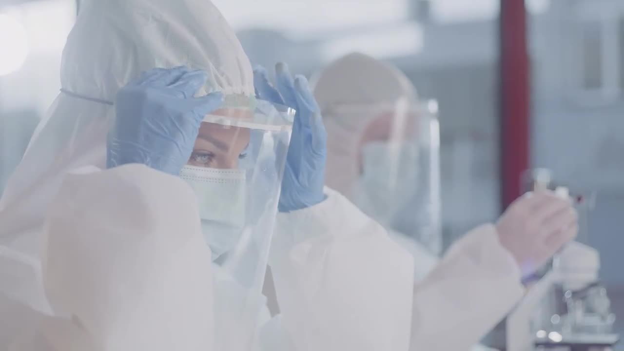 Doctor Putting On Face Shield - Stock Video | Motion Array