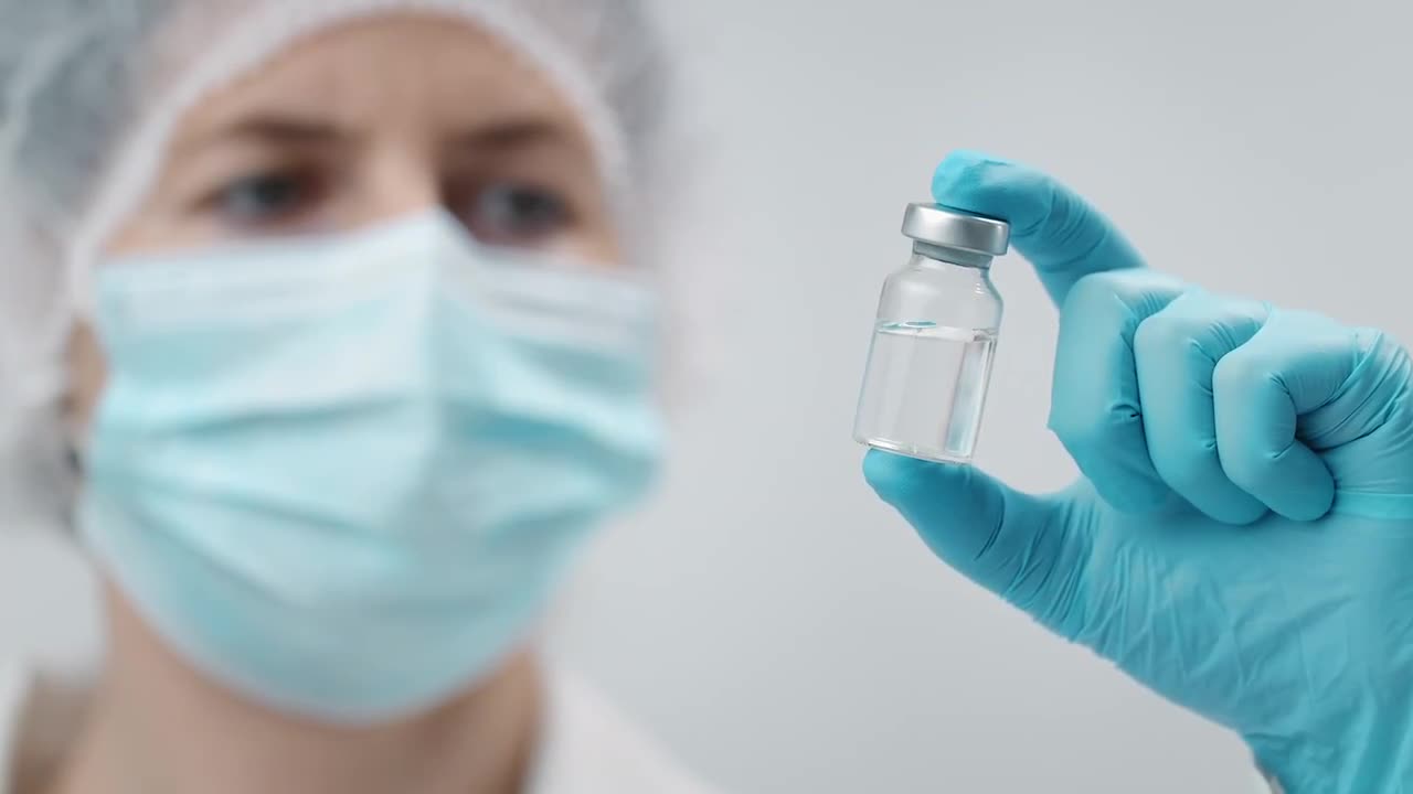 Doctor Holding Medicine In Vial - Stock Video | Motion Array