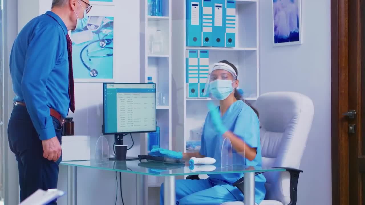 Nurse Checks-In Senior Patient - Stock Video | Motion Array