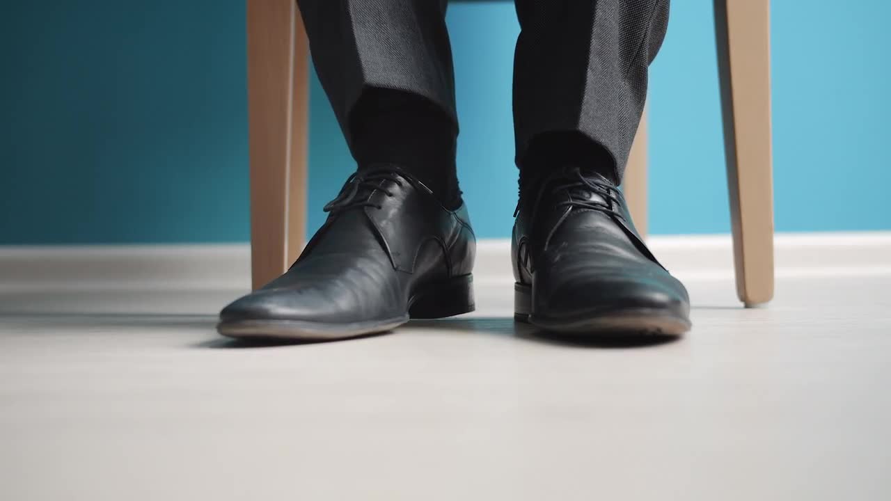 Tapping His Foot Nervously - Stock Video | Motion Array