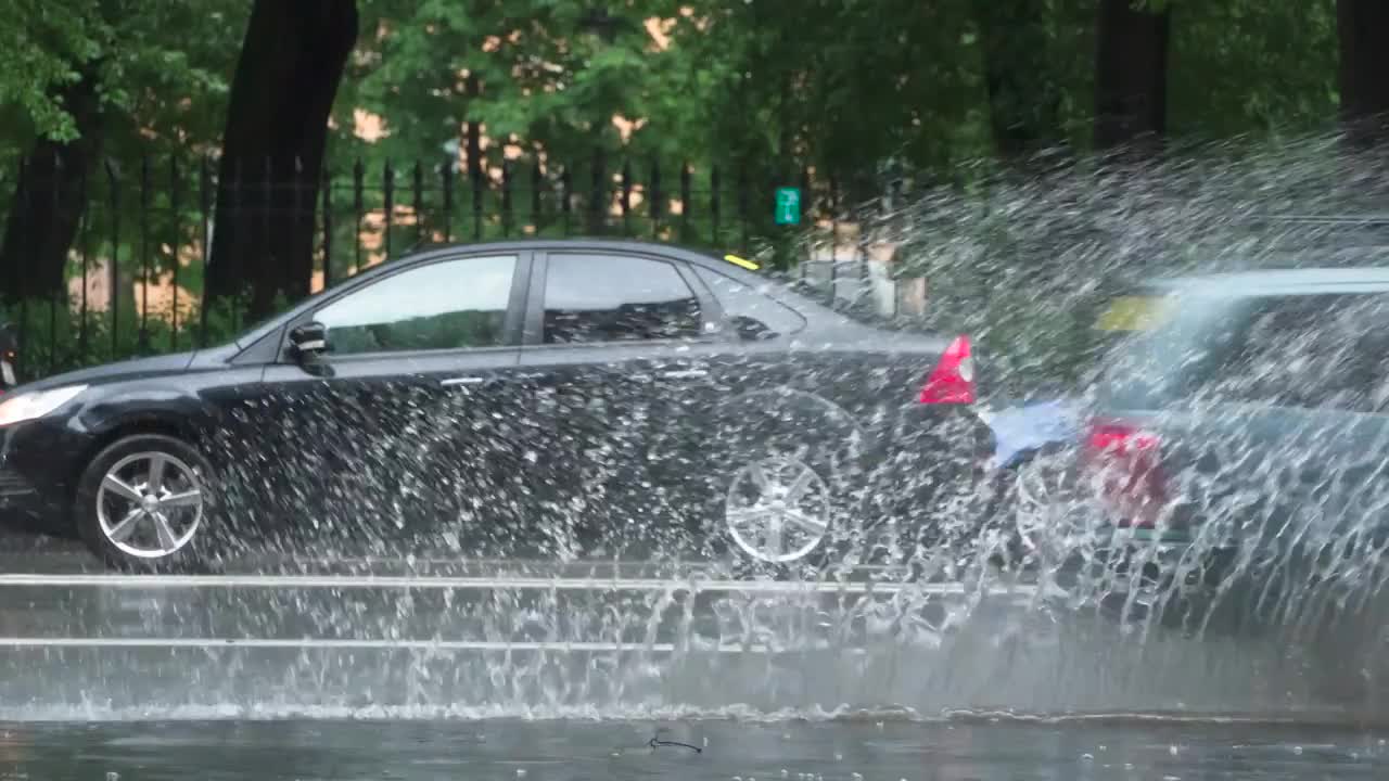 Cars Drive Through Rain - Stock Video | Motion Array