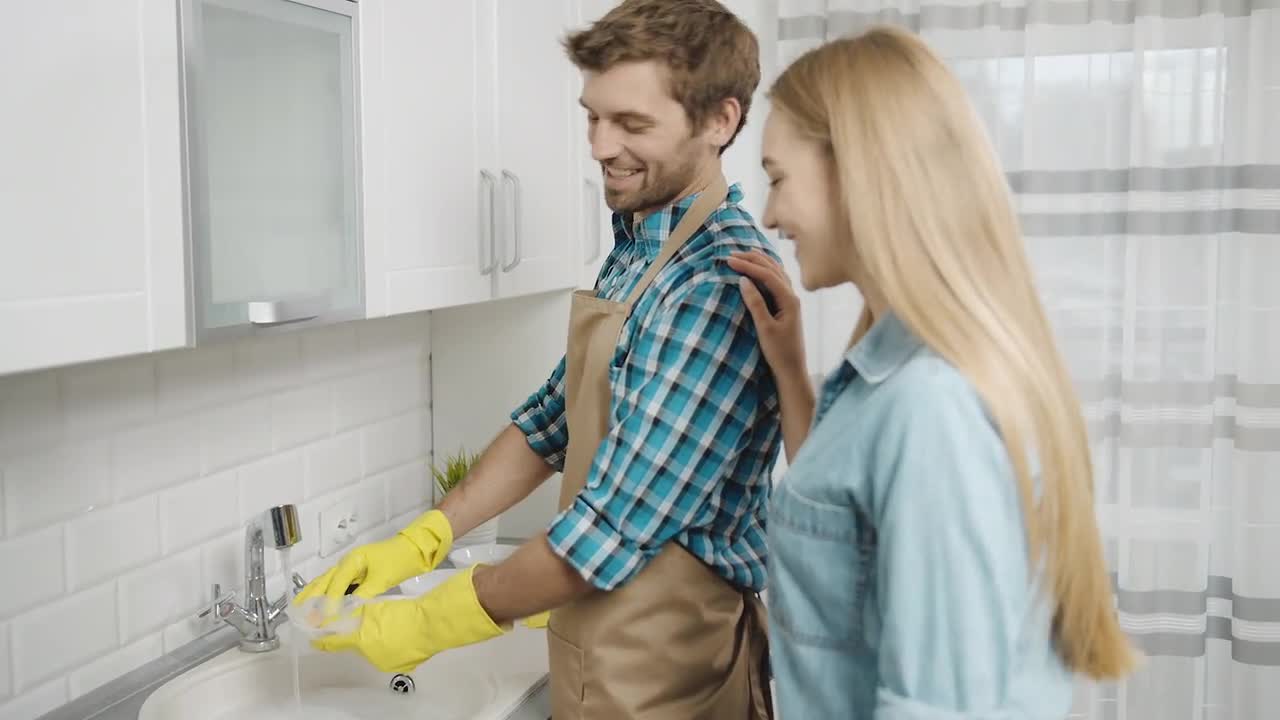 Husband Washing Dishes In Kitchen - Stock Video | Motion Array