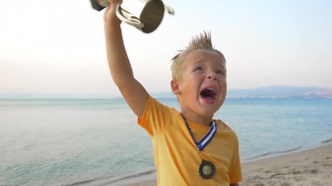 Young Boy Lifting The Trophy - Stock Video | Motion Array