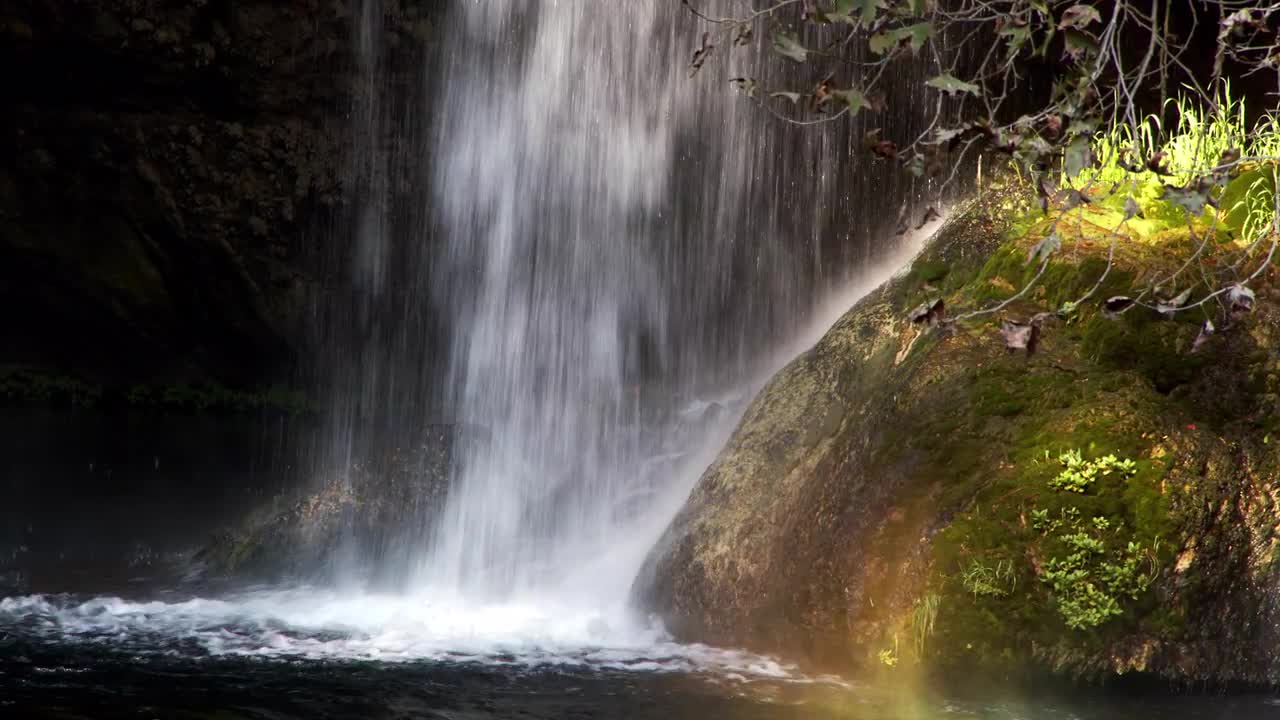 A Waterfall Crashing Against Rocks - Stock Video | Motion Array