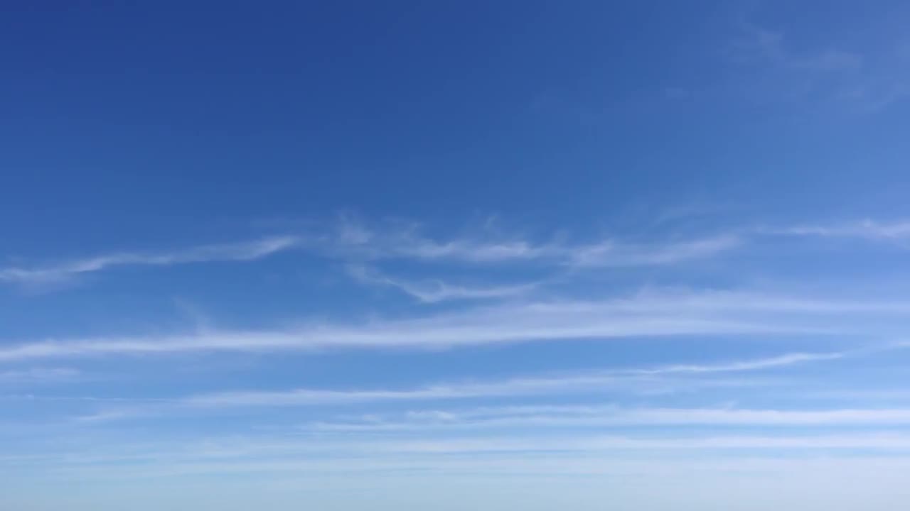 Wispy Clouds On Blue Sky - Stock Video | Motion Array