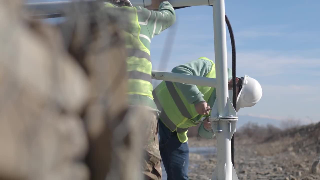 Two Workers Fixing Something - Stock Video | Motion Array