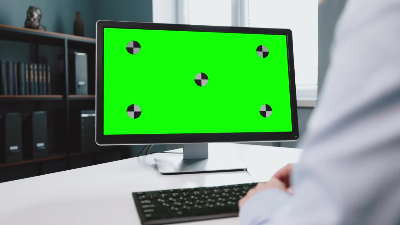 Working On A Computer With Green Screen - Stock Video | Motion Array