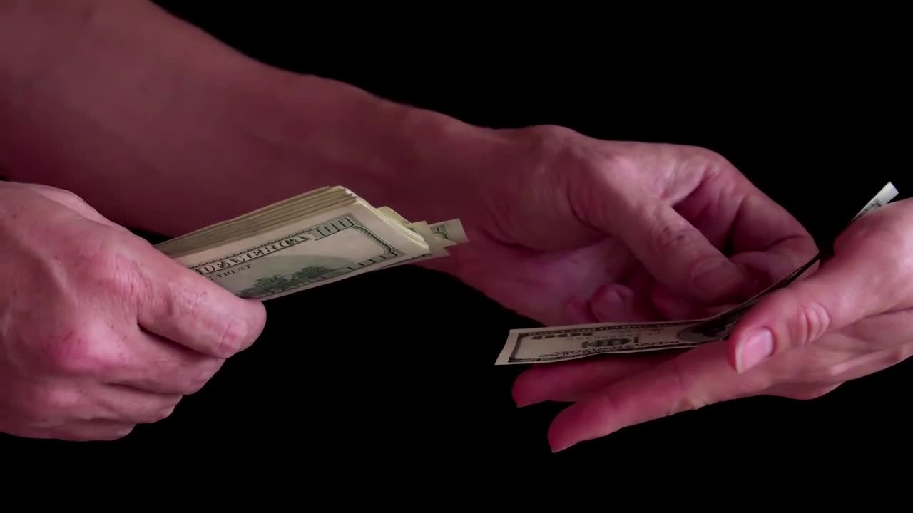 Man Handing Money To Woman - Stock Video | Motion Array