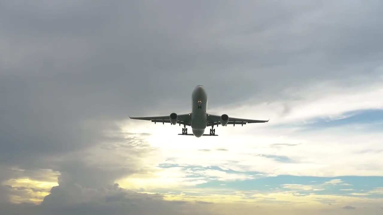 Airplane Descending Over Beach - Stock Video | Motion Array