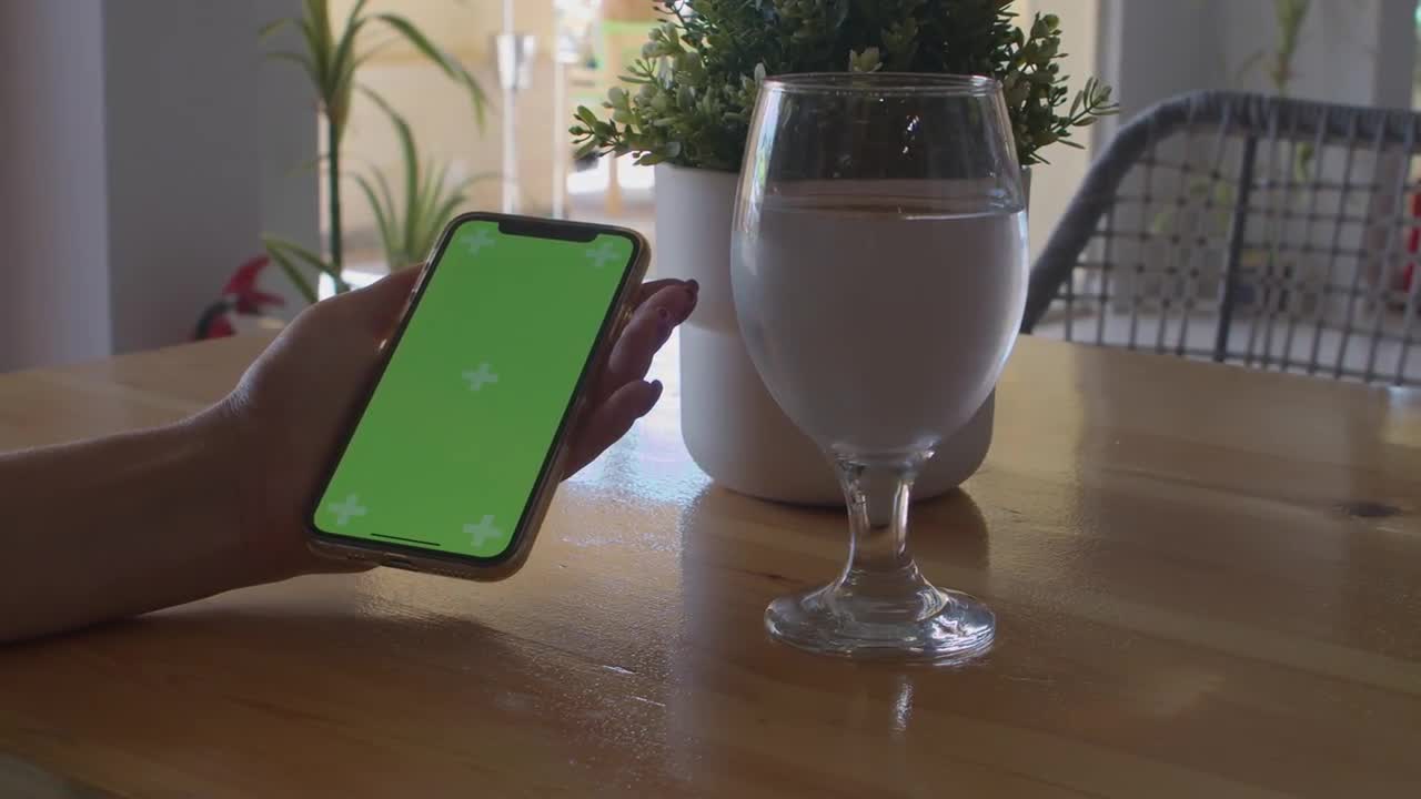 Hand Holding Green Screen Smartphone - Stock Video | Motion Array