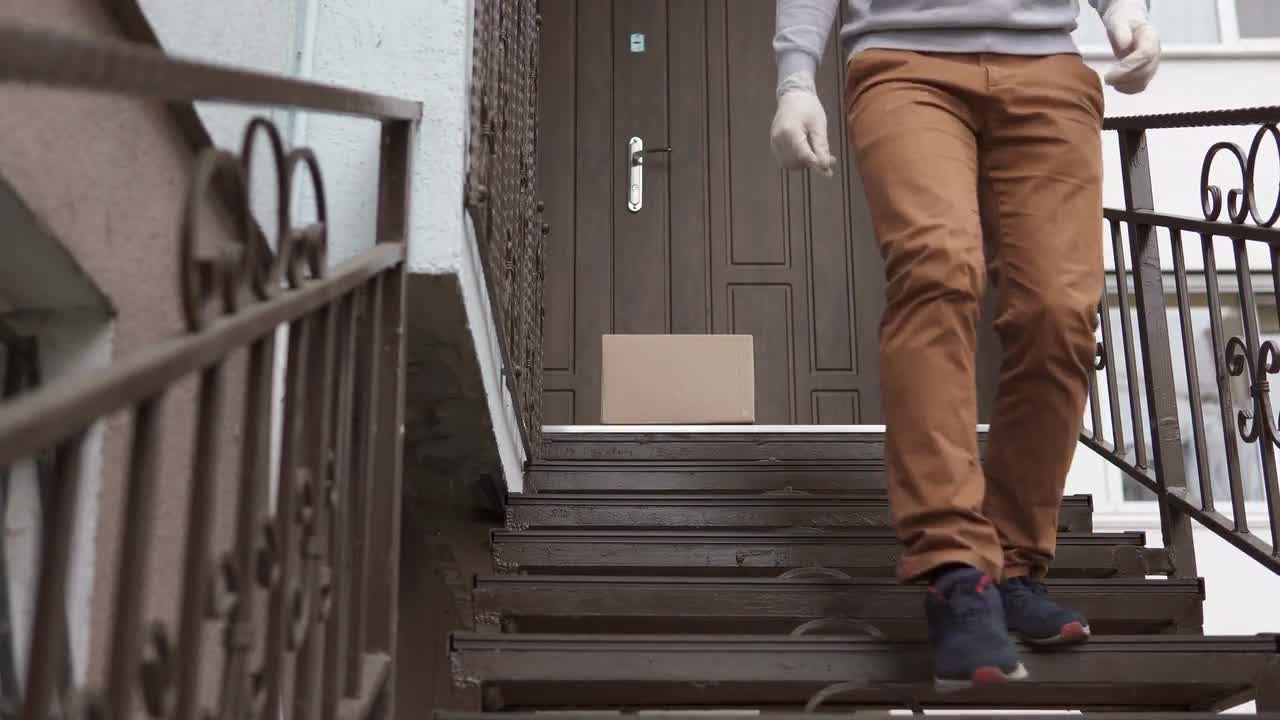 Leaving A Parcel At The Door - Stock Video | Motion Array