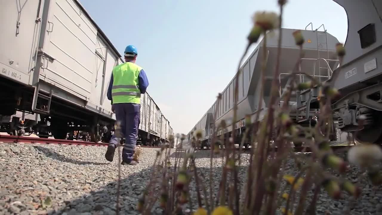 Rail Yard Worker Between Trains - Stock Video | Motion Array